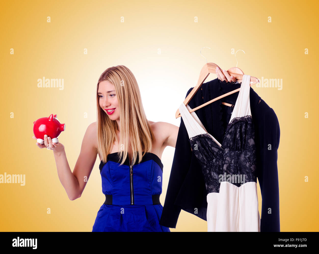 Woman thinking of spending her savings on clothing Stock Photo - Alamy