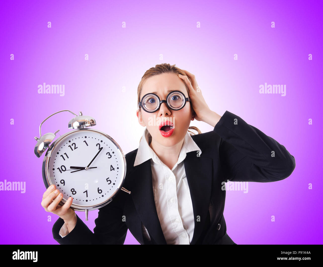 Woman businesswoman with giant clock Stock Photo - Alamy