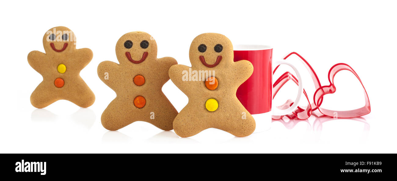 Three Gingerbread Men on a White background Stock Photo - Alamy