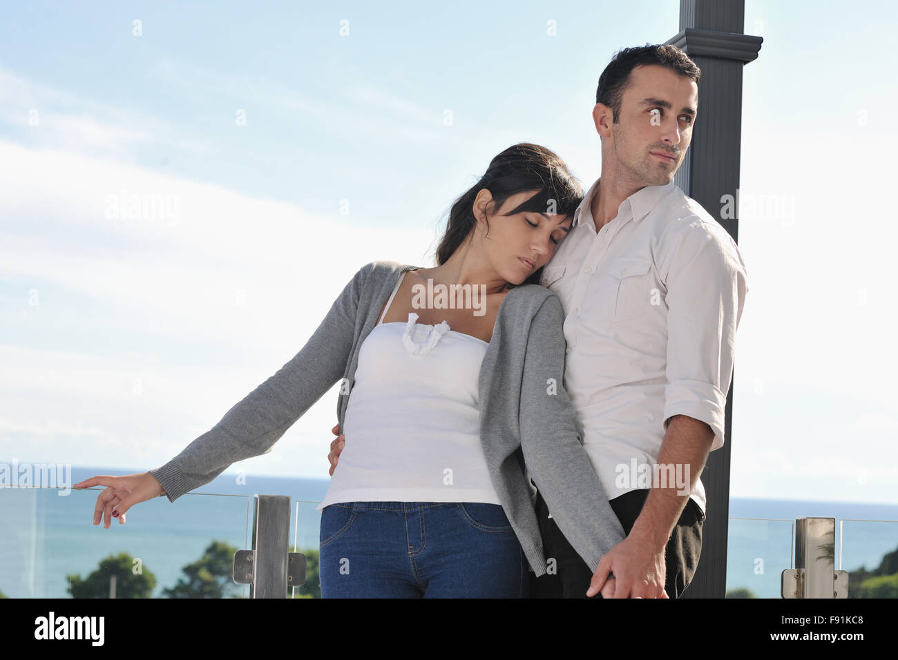 happy young couple in love have romance relax on balcony outdoor with ...