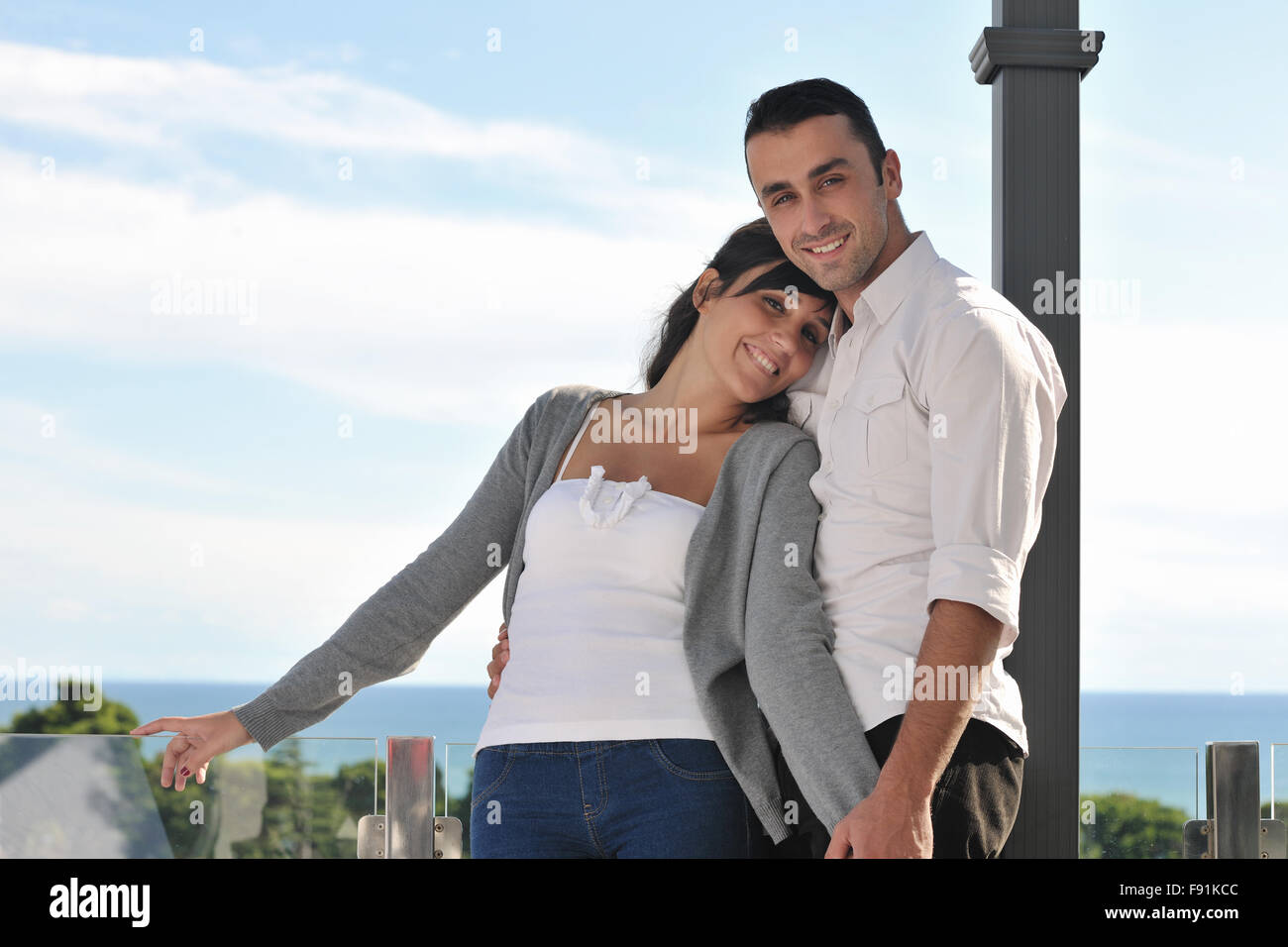 happy young couple in love have romance relax on balcony outdoor with ...