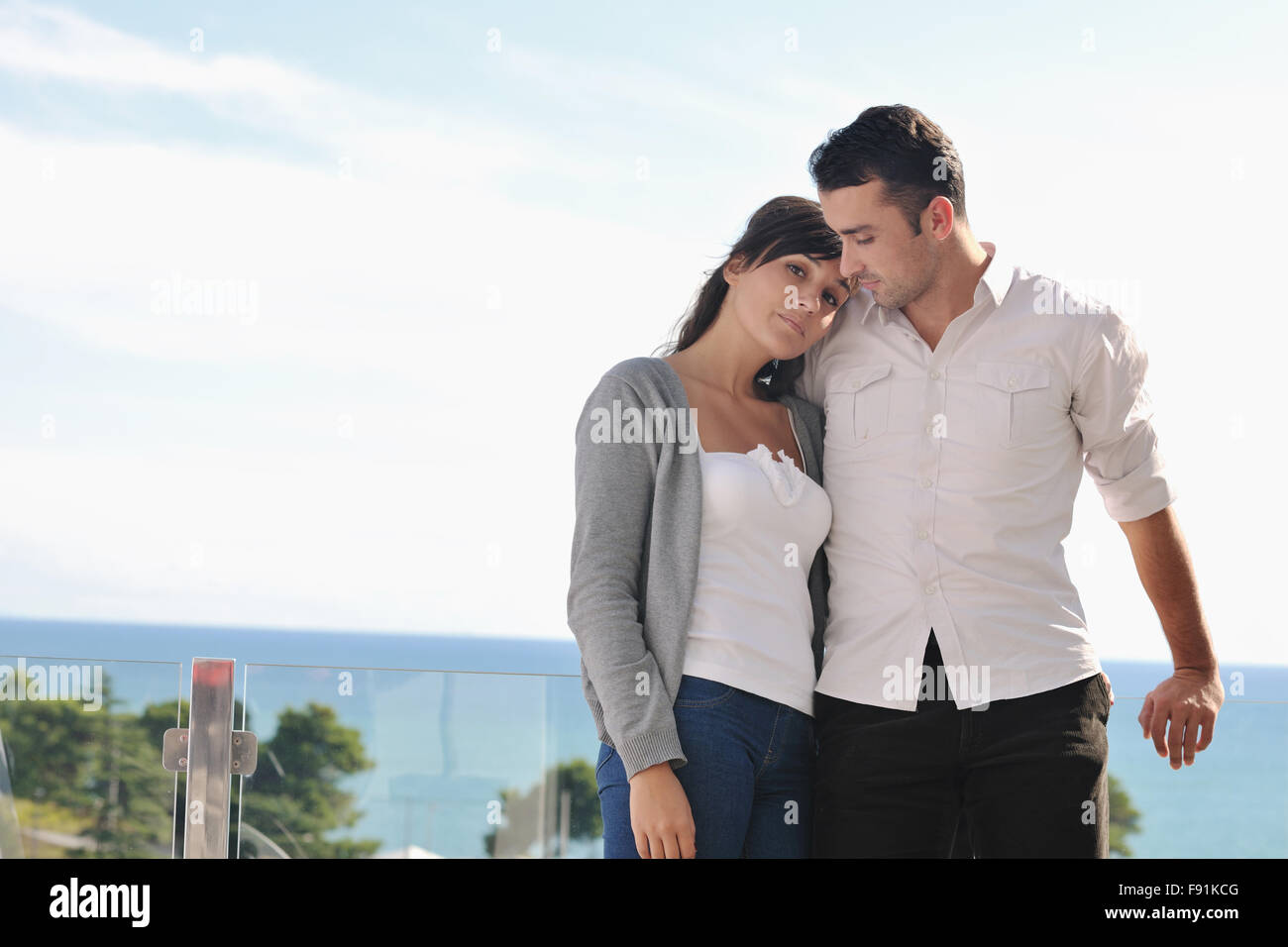 happy young couple in love have romance relax on balcony outdoor with ...