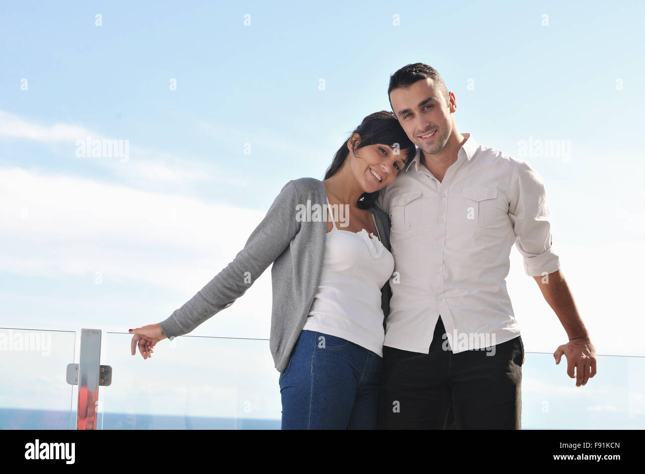 happy young couple in love have romance relax on balcony outdoor with ...