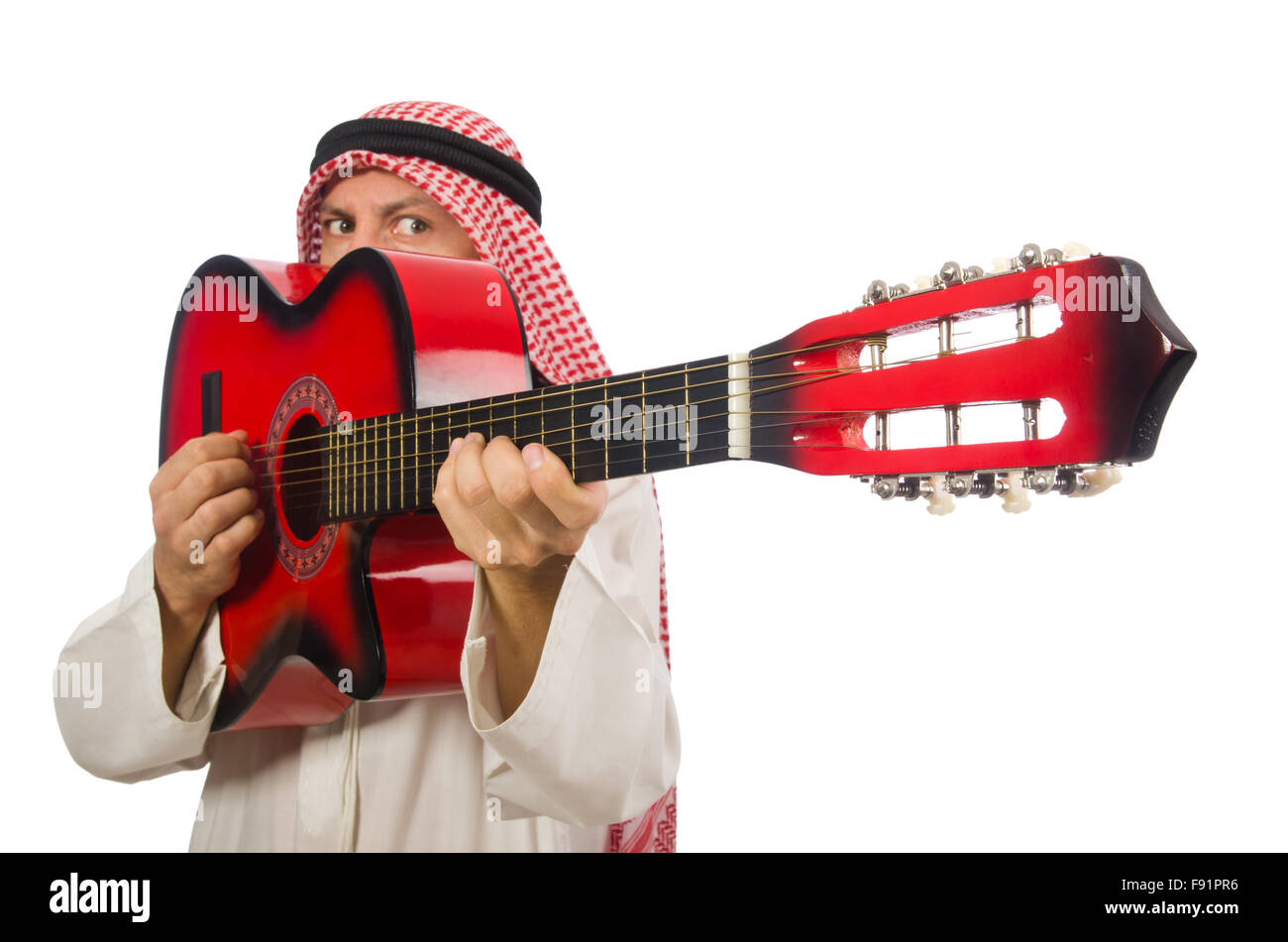 Arab man playing isolated on white Stock Photo - Alamy
