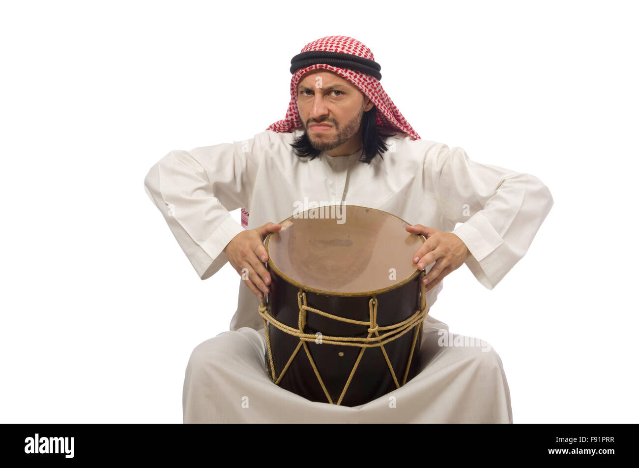 Arab man playing drum isolated on white Stock Photo - Alamy