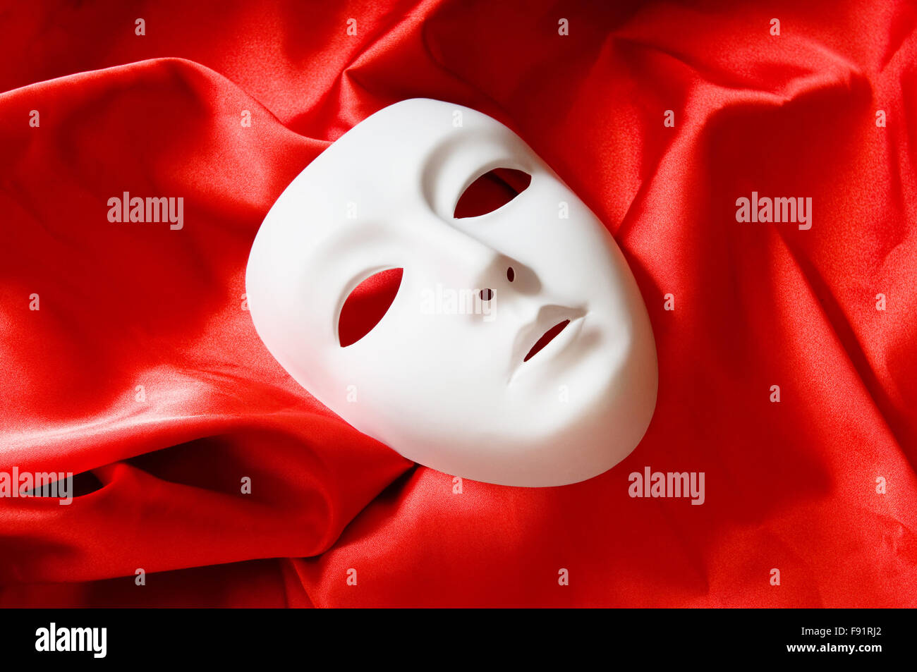 Theatre concept with the white plastic masks Stock Photo - Alamy