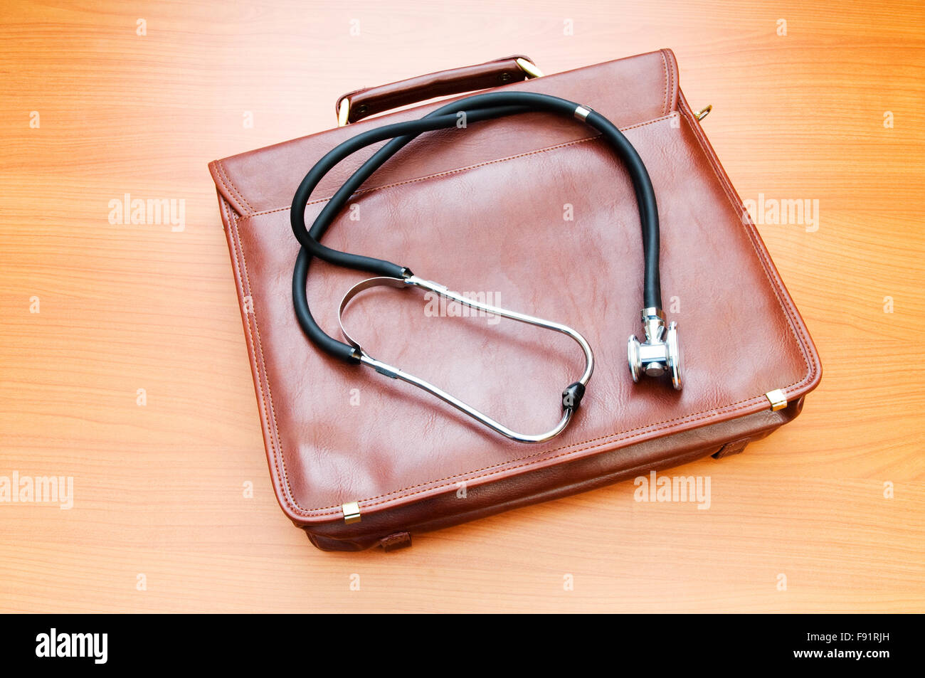 Doctor's case with stethoscope against wooden background Stock Photo ...
