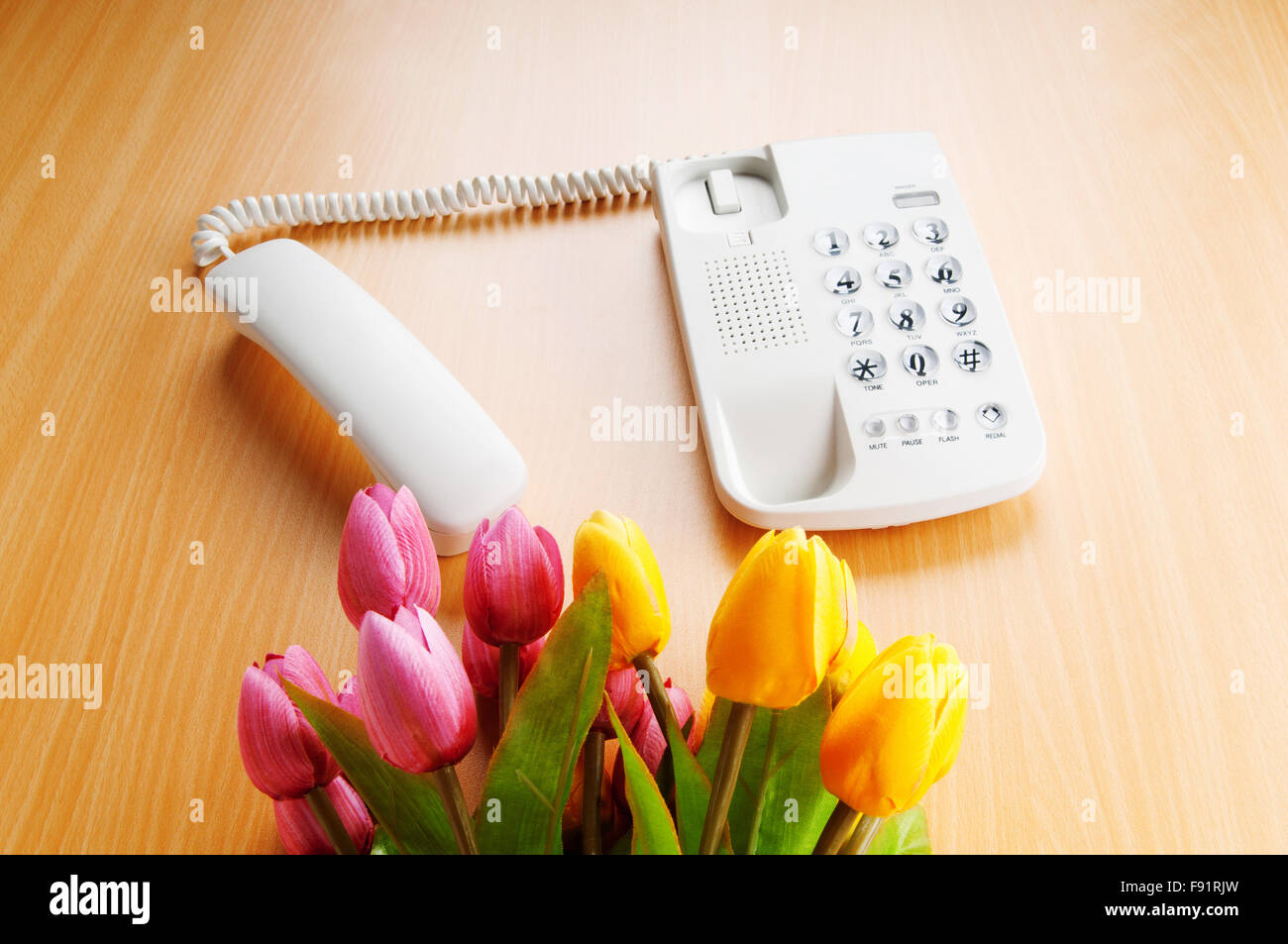 Romantic concept with phone and tulip flowers Stock Photo - Alamy