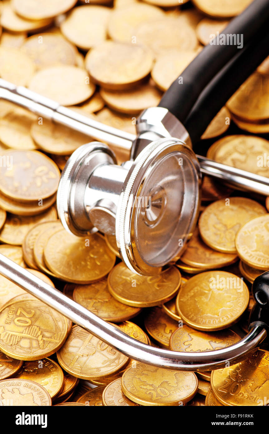 Concept of expensive healthcare with coins and stethoscope Stock Photo ...