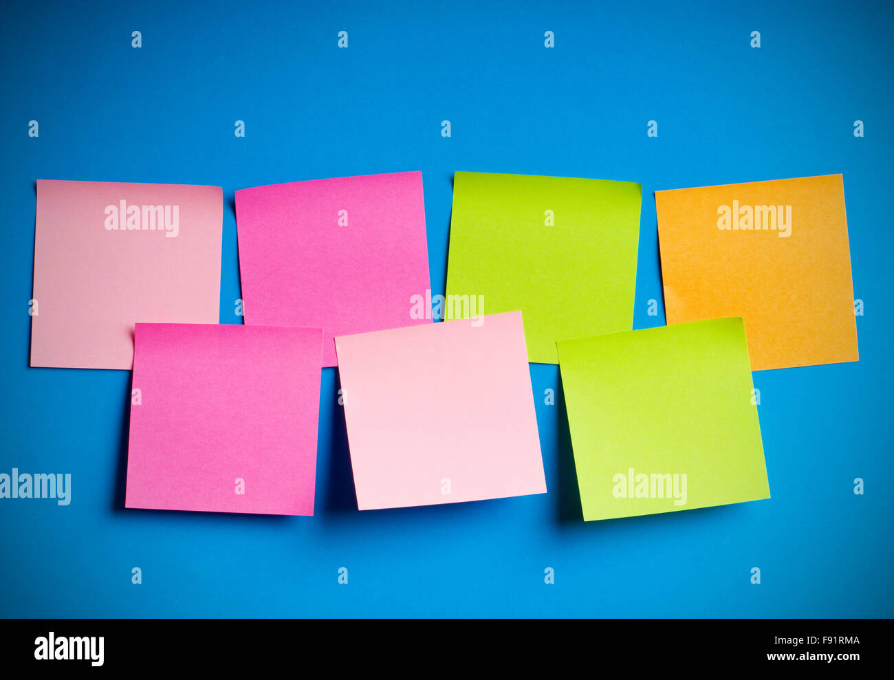 Reminder notes on the bright colorful paper Stock Photo - Alamy