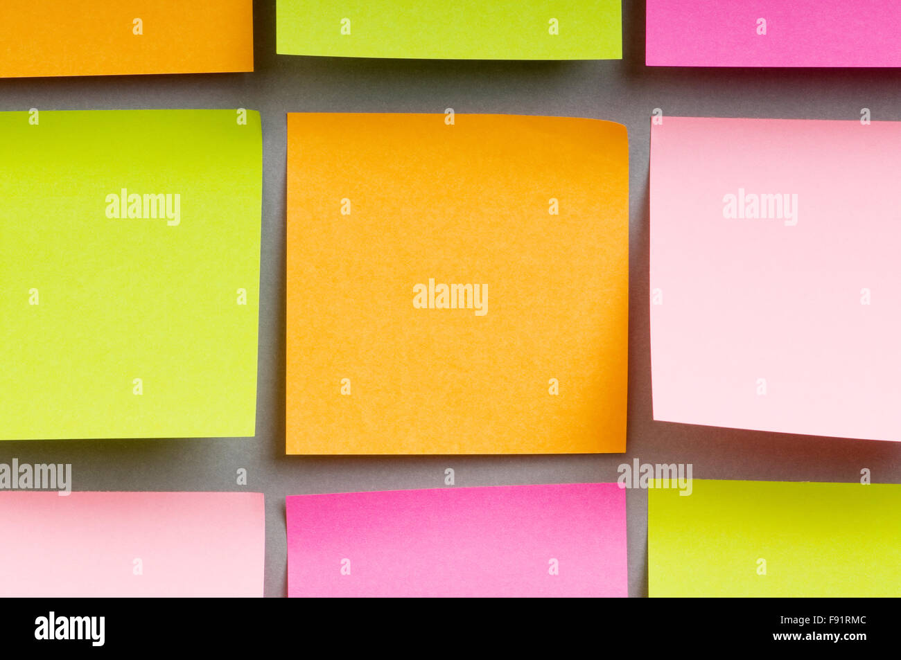 Reminder notes on the bright colorful paper Stock Photo - Alamy