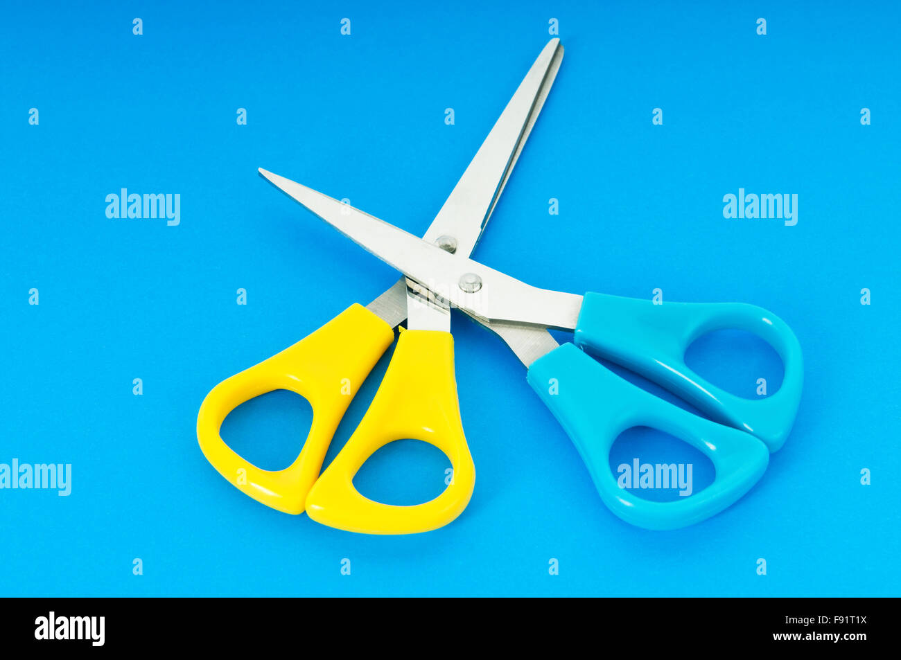 Colorful scissors on the color paper background Stock Photo - Alamy