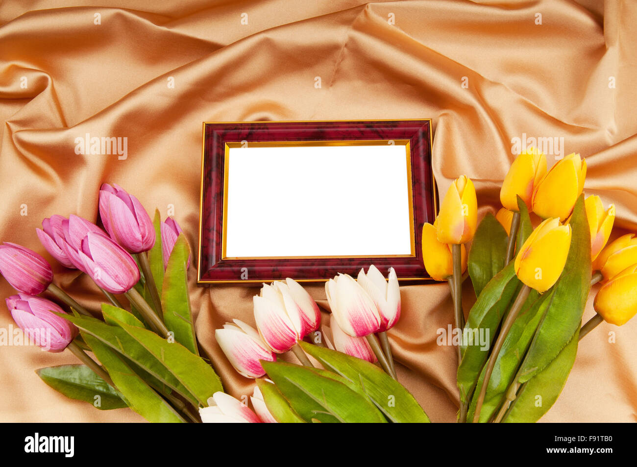 Picture frames and tulips flowers on satin Stock Photo - Alamy