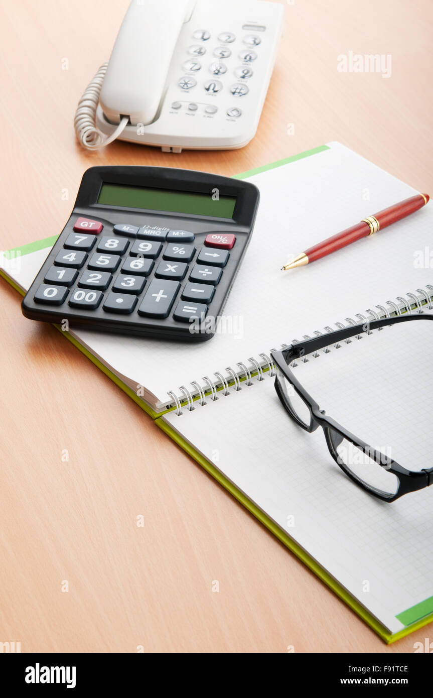 Business concept with notepad and calculator Stock Photo - Alamy