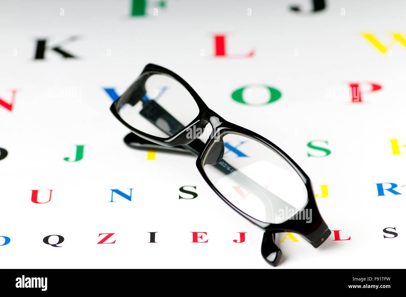 Optical reading glasses on the eyesight table Stock Photo - Alamy