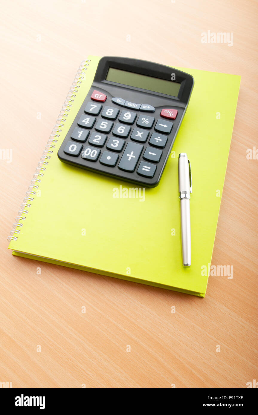 Business concept with notepad and calculator Stock Photo - Alamy