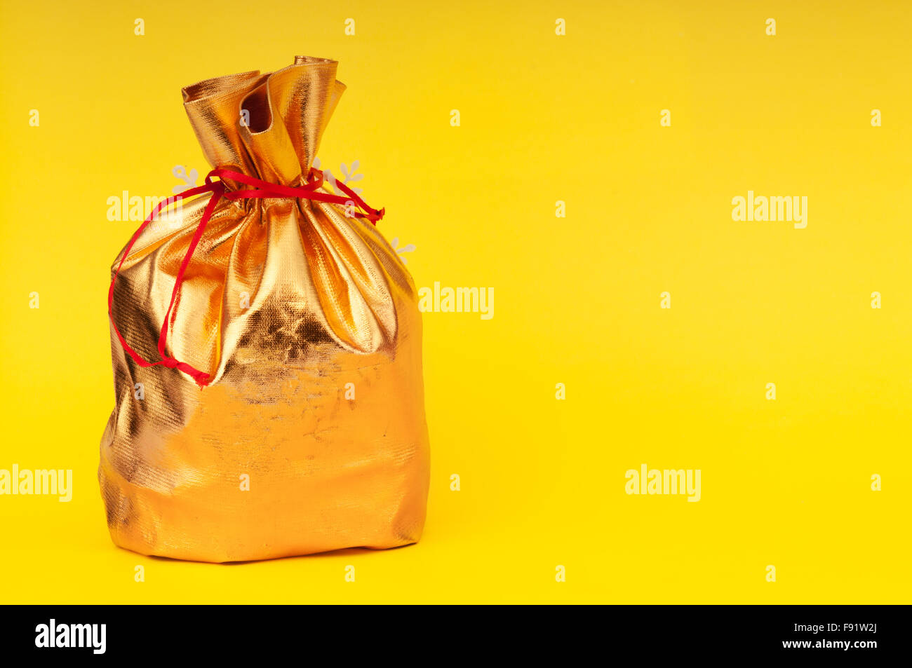 Golden sacks full of something good Stock Photo - Alamy