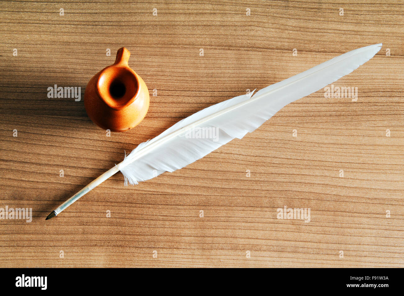 Writing feather on the background Stock Photo - Alamy