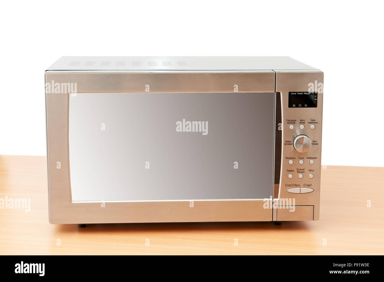Microwave oven on the table Stock Photo - Alamy