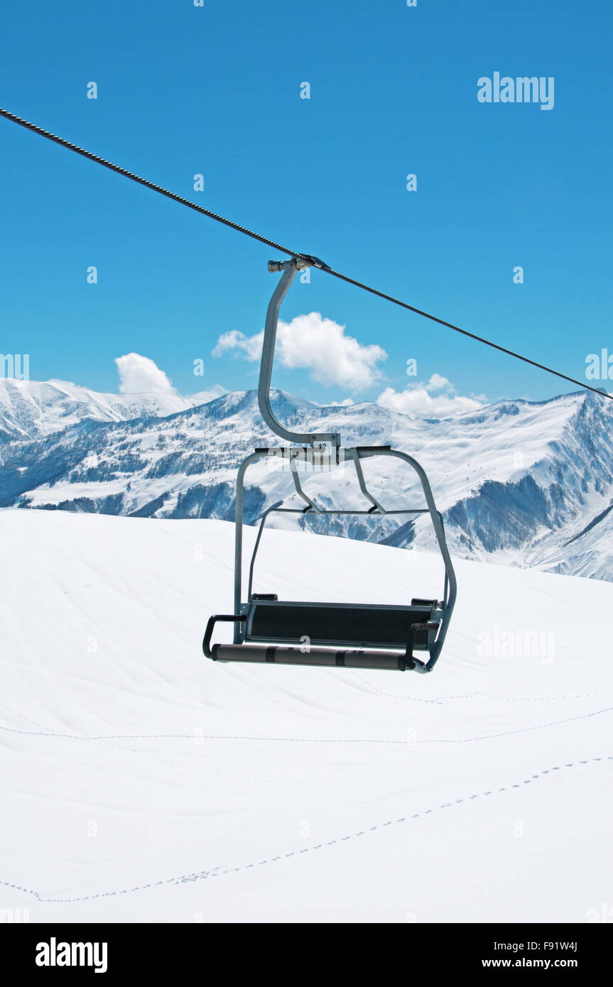 Ski lift chairs on bright winter day Stock Photo - Alamy