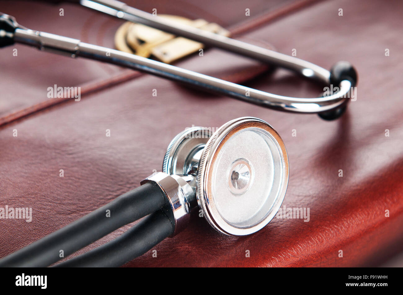 Leather briefcase and stethoscope hi-res stock photography and images ...