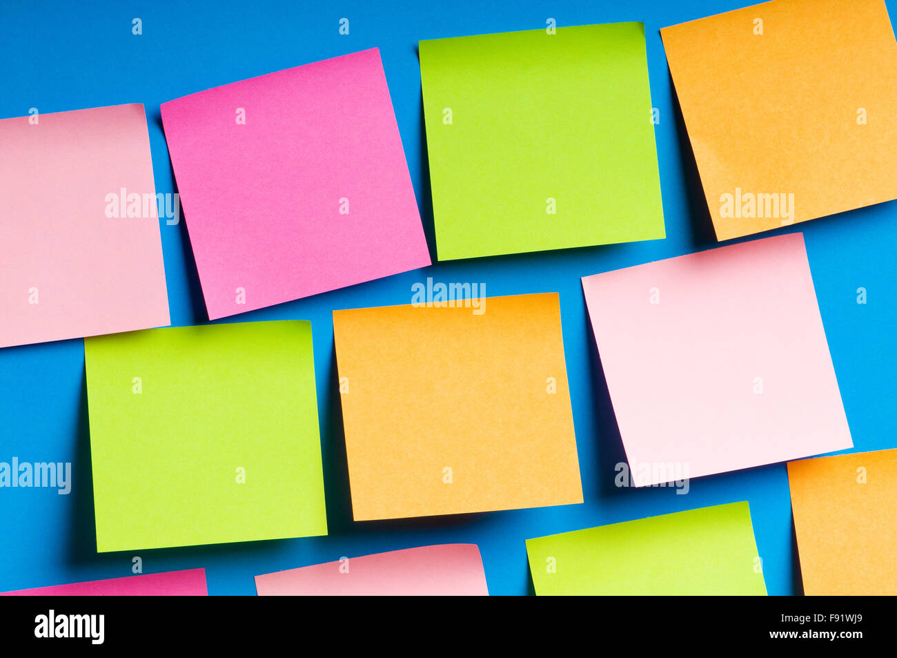 Reminder notes on the bright colorful paper Stock Photo - Alamy