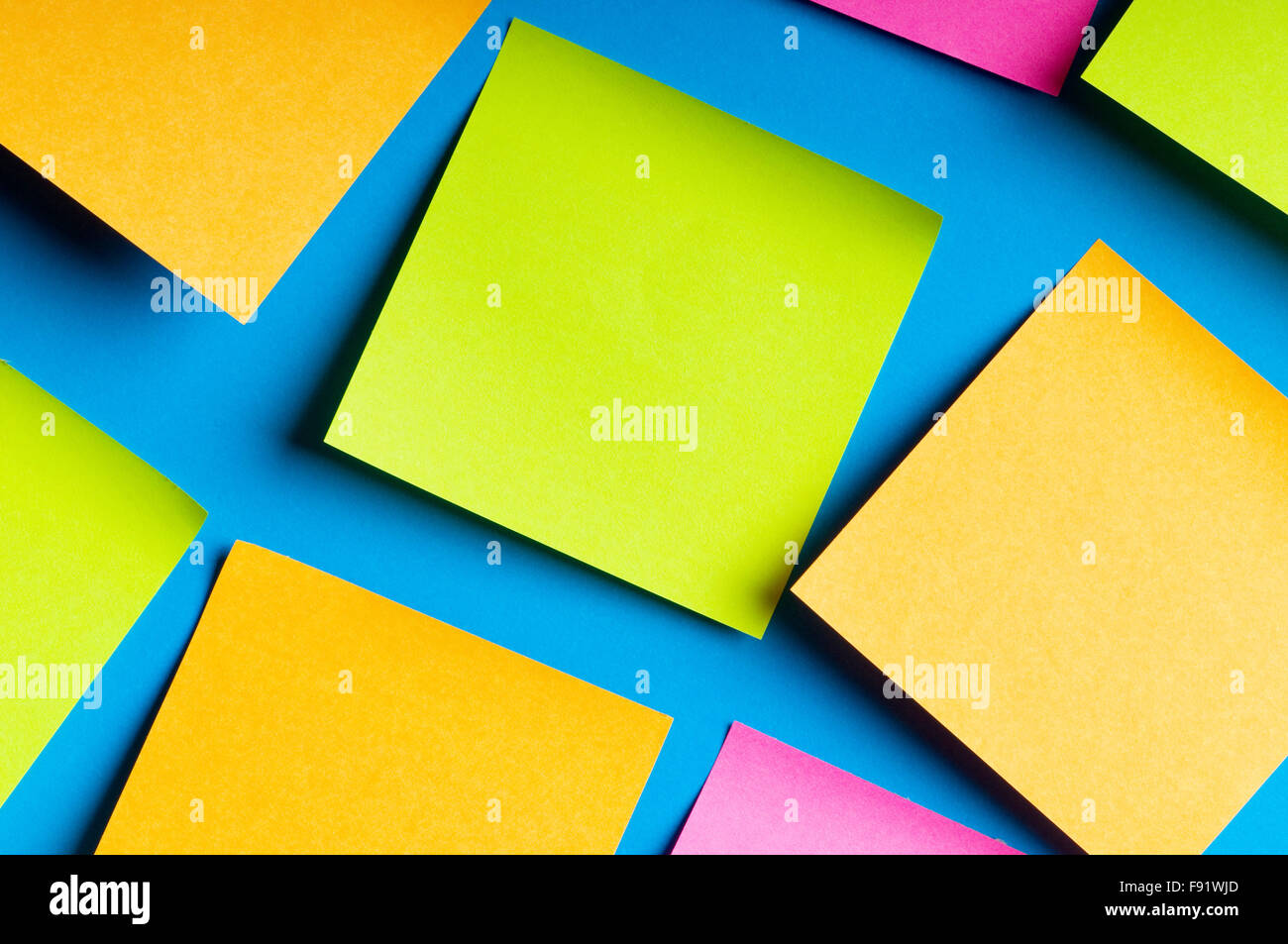 Reminder notes on the bright colorful paper Stock Photo - Alamy