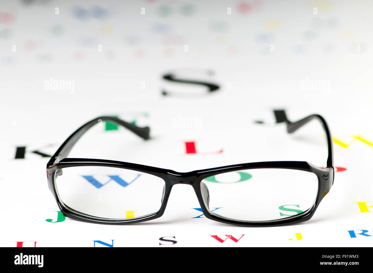Optical reading glasses on the eyesight table Stock Photo - Alamy