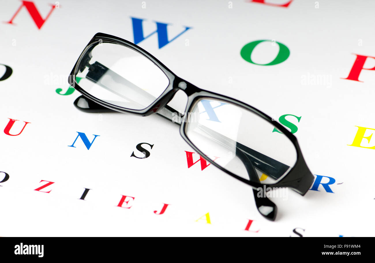 Optical reading glasses on the eyesight table Stock Photo - Alamy