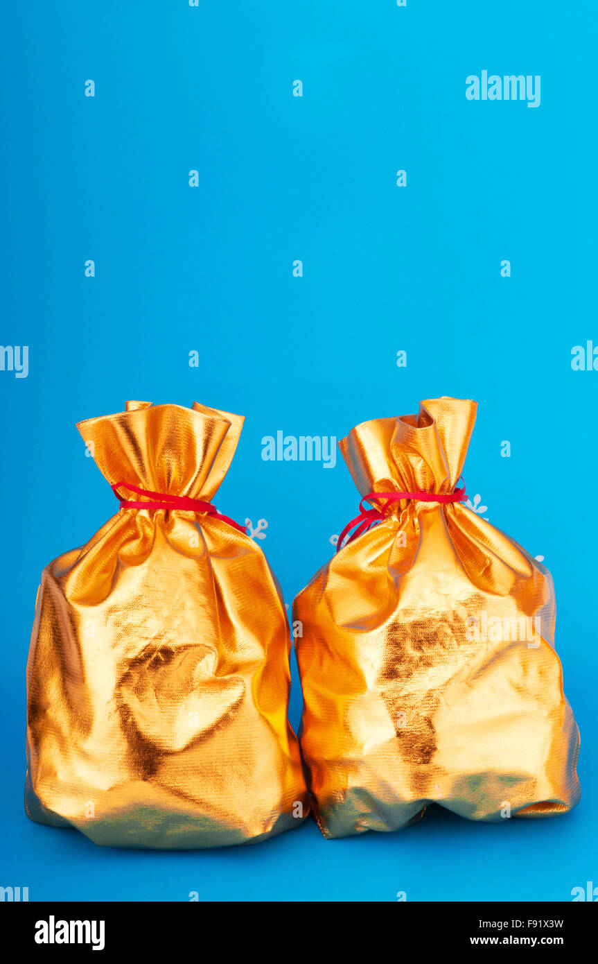 Golden sacks full of something good Stock Photo - Alamy