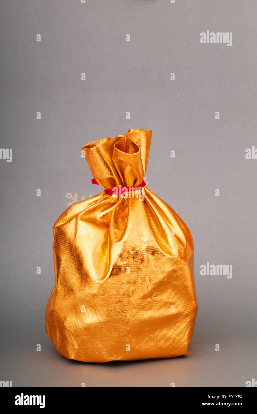 Golden sacks full of something good Stock Photo - Alamy