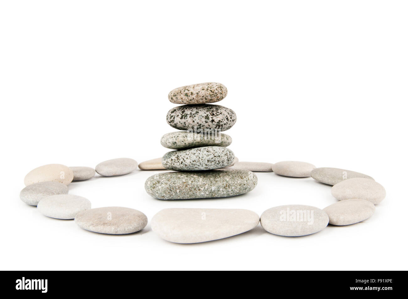 Stack of pebbles isolated on the white Stock Photo - Alamy
