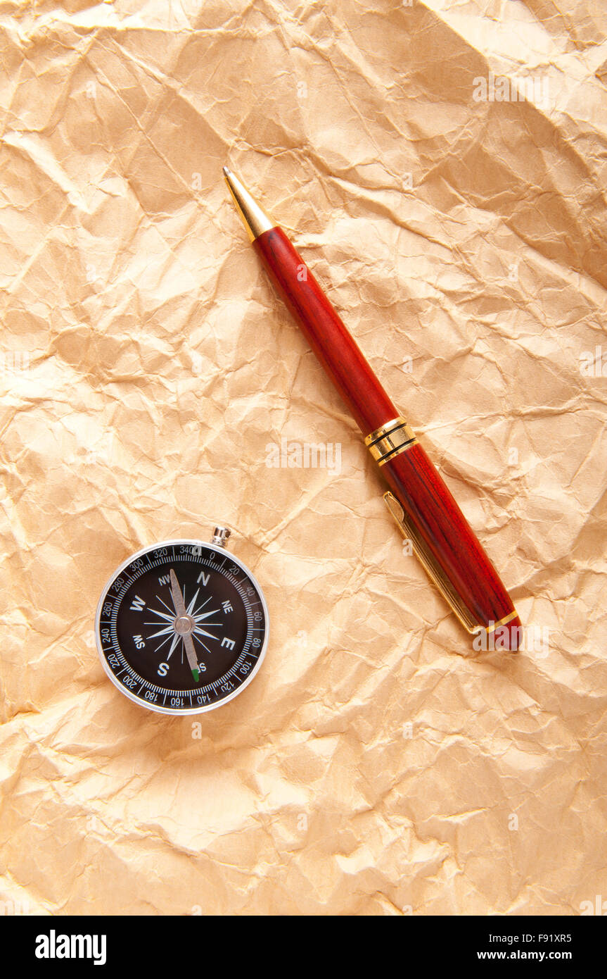 Vintage compass on the paper in adventure concept Stock Photo - Alamy