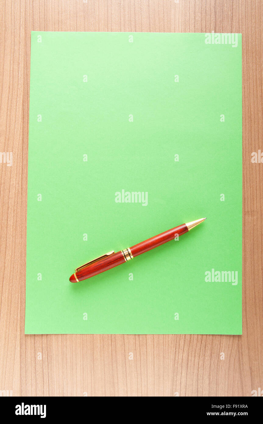 Paper background with pen Stock Photo - Alamy