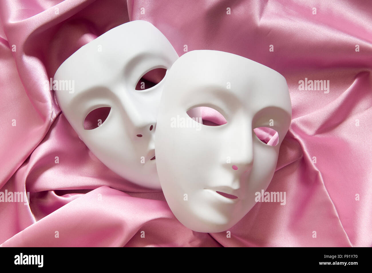 Theatre concept with the white plastic masks Stock Photo - Alamy