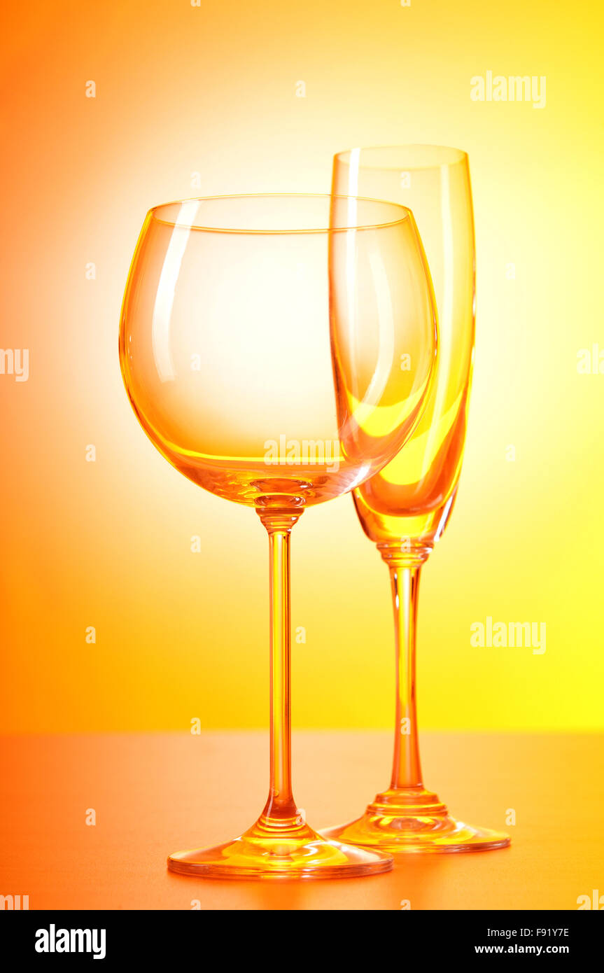 Wine glasses against gradient background Stock Photo - Alamy