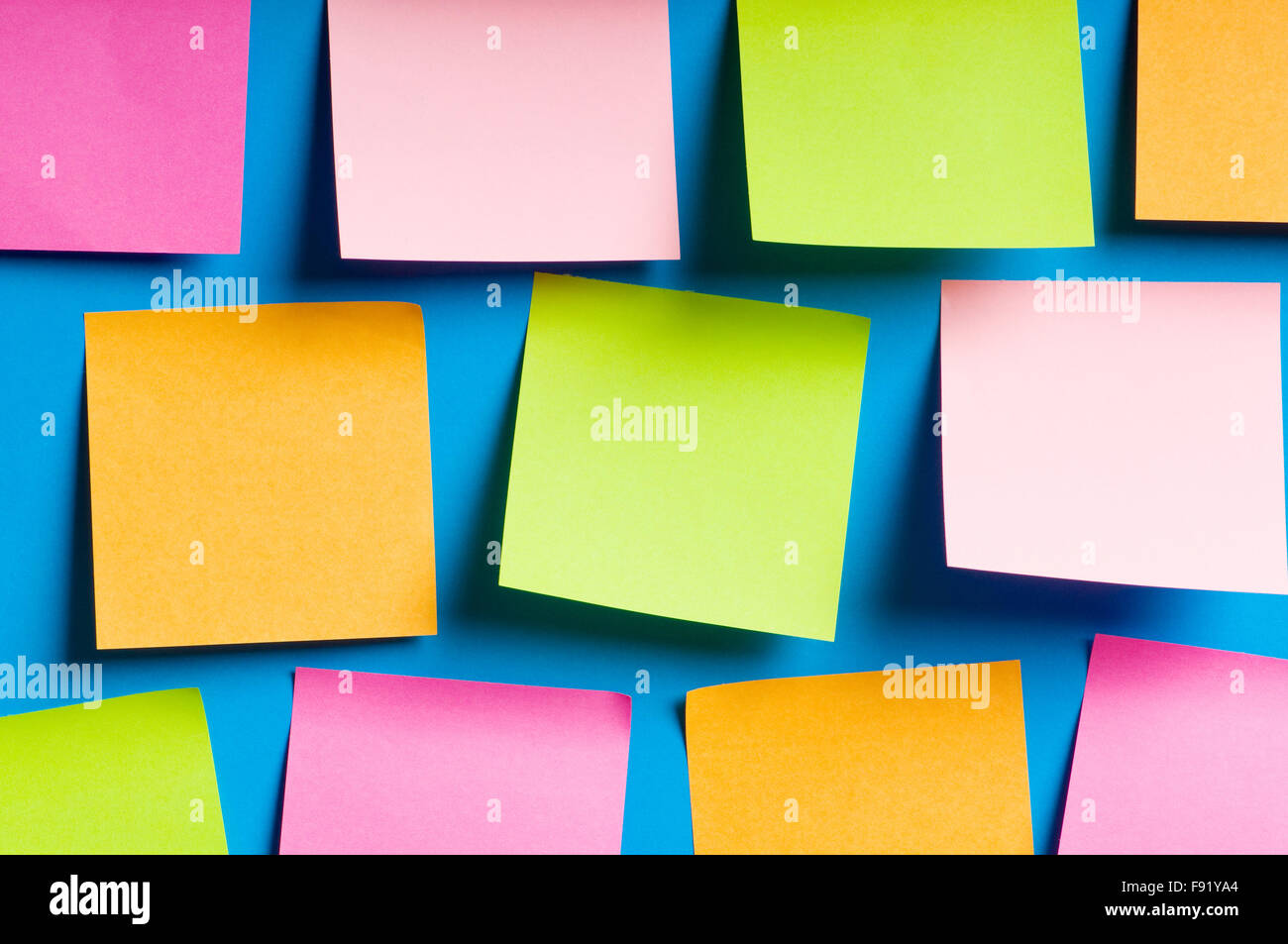 Reminder notes on the bright colorful paper Stock Photo - Alamy