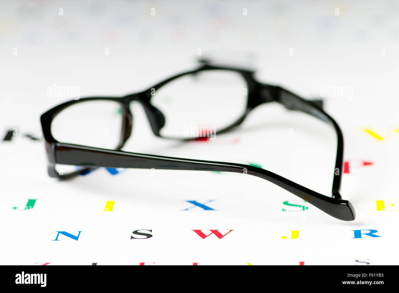 Optical reading glasses on the eyesight table Stock Photo - Alamy
