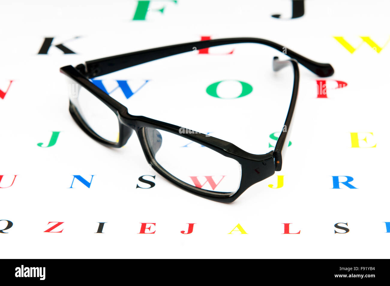 Optical reading glasses on the eyesight table Stock Photo - Alamy