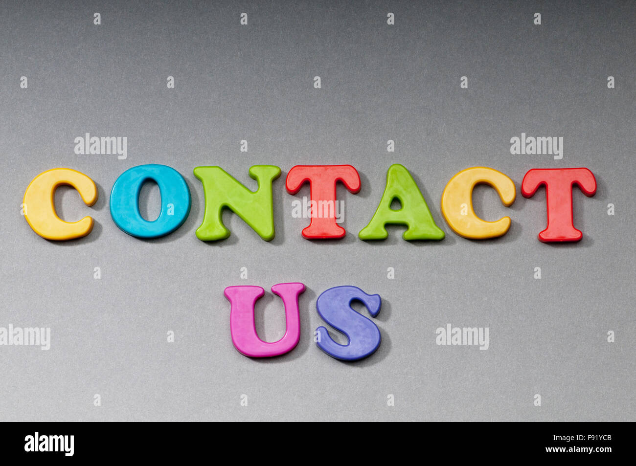 Contact us concept with letters on background Stock Photo - Alamy