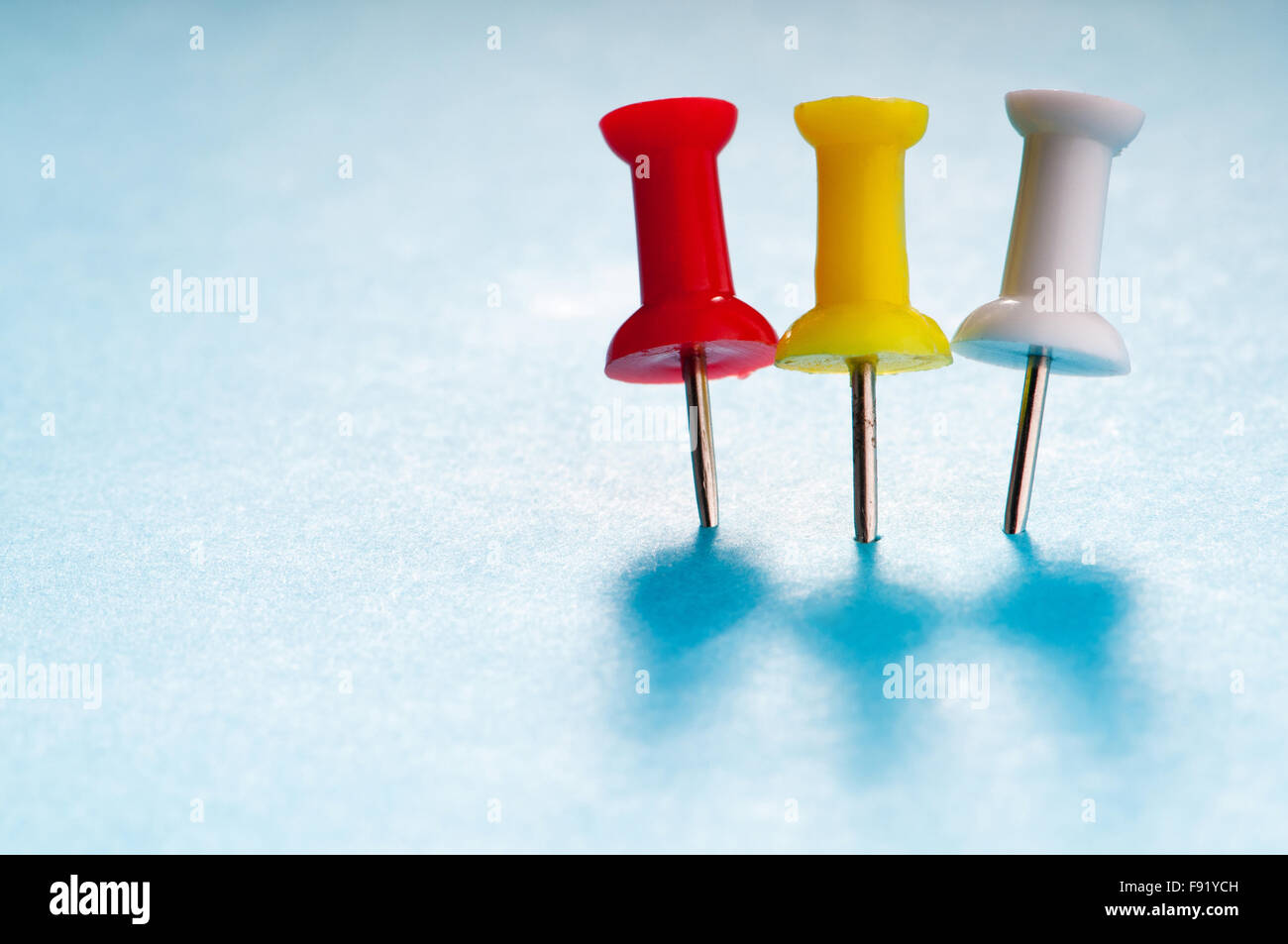 Office pins on the paper Stock Photo - Alamy