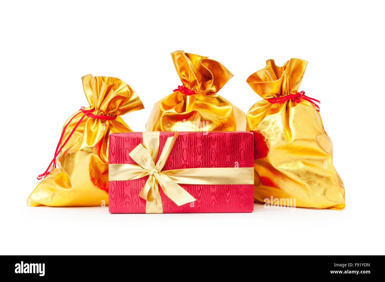 Gift boxes and golden sacks Stock Photo - Alamy