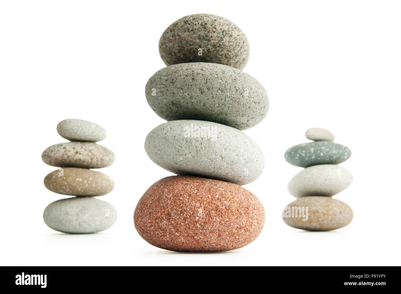 Stack of pebbles isolated on the white Stock Photo - Alamy