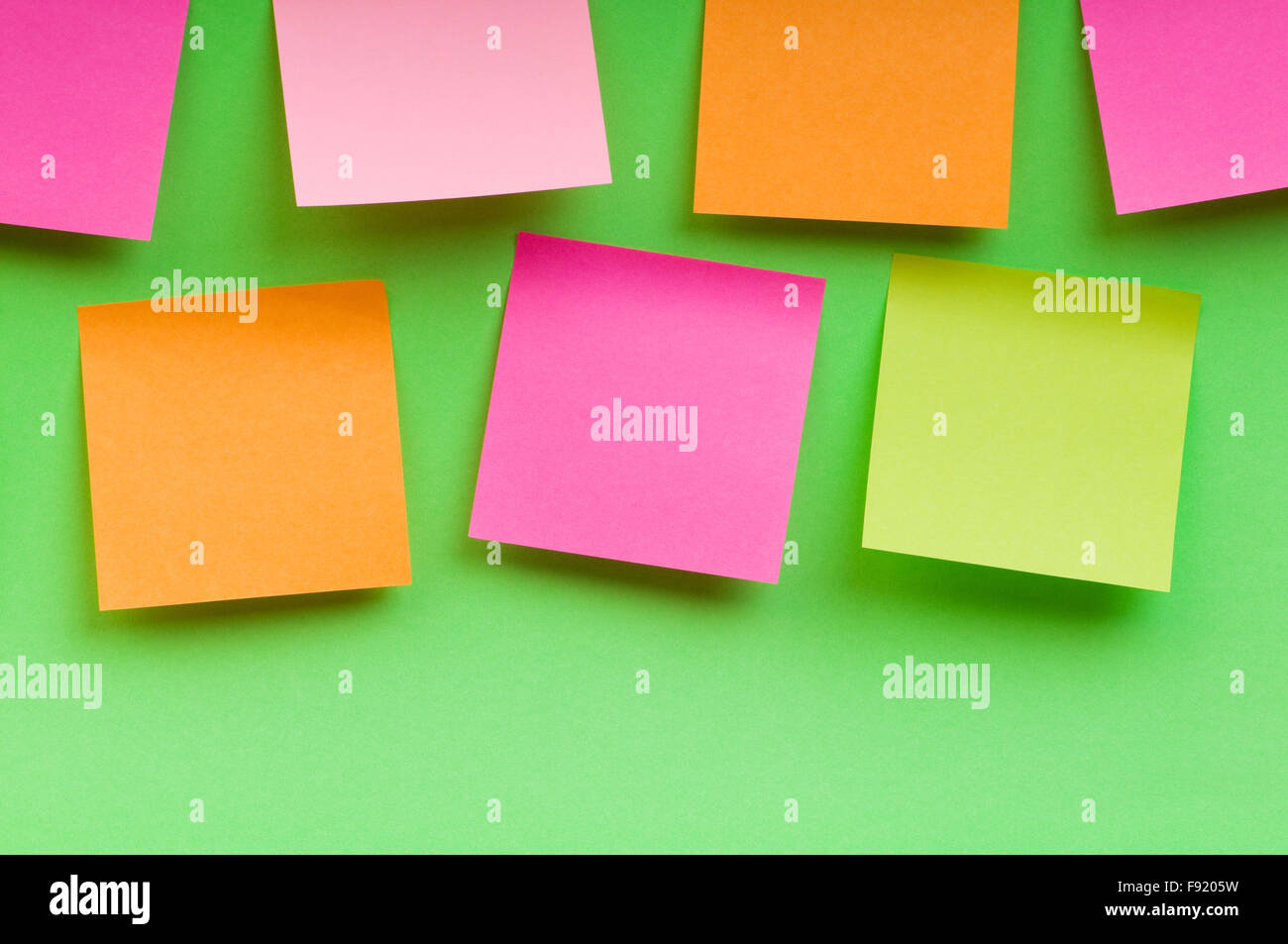 Reminder notes on the bright colorful paper Stock Photo - Alamy