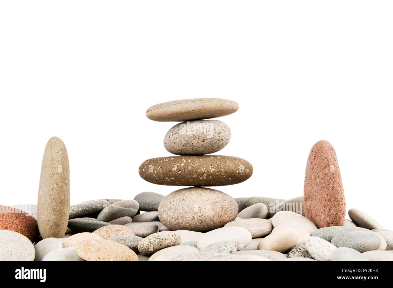Stack of pebbles isolated on the white Stock Photo - Alamy
