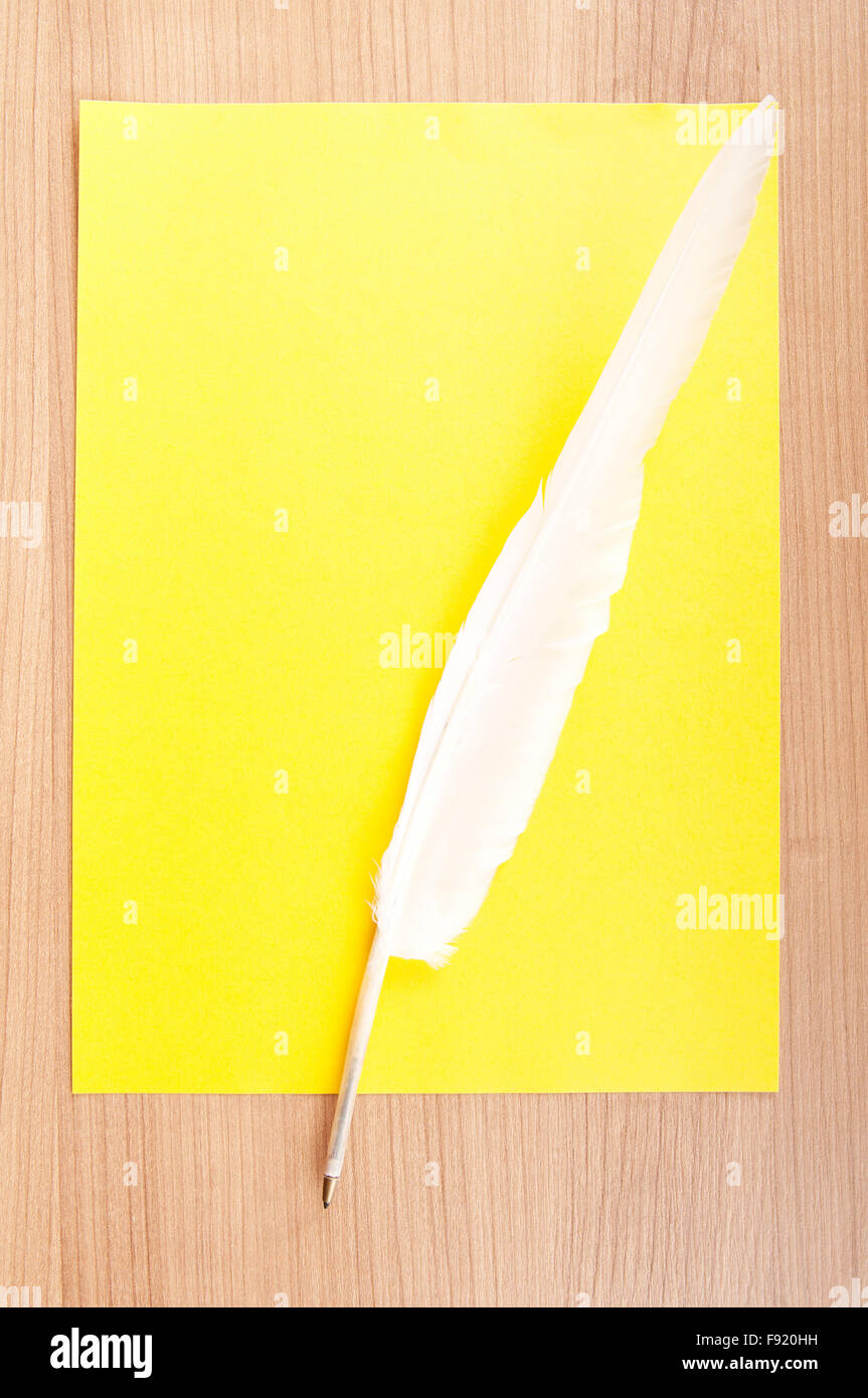 Paper and feather in vintage writing concept Stock Photo - Alamy