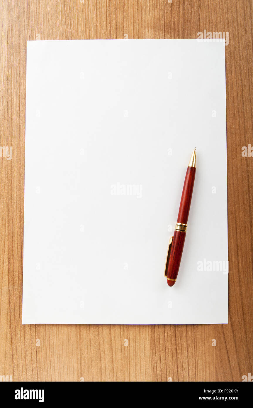 Pen on the sheet of paper Stock Photo - Alamy