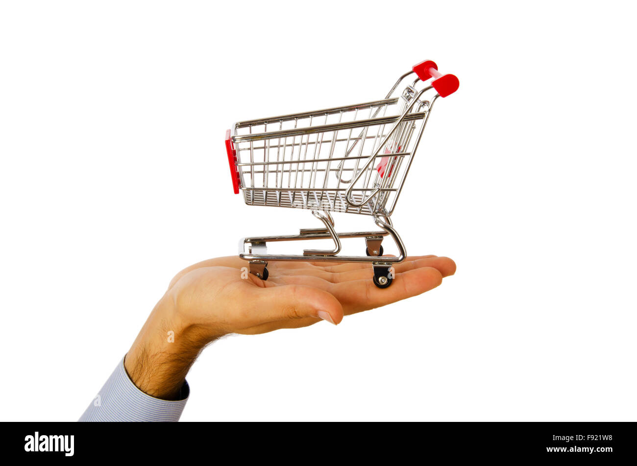 Hand holding shopping cart on white Stock Photo - Alamy
