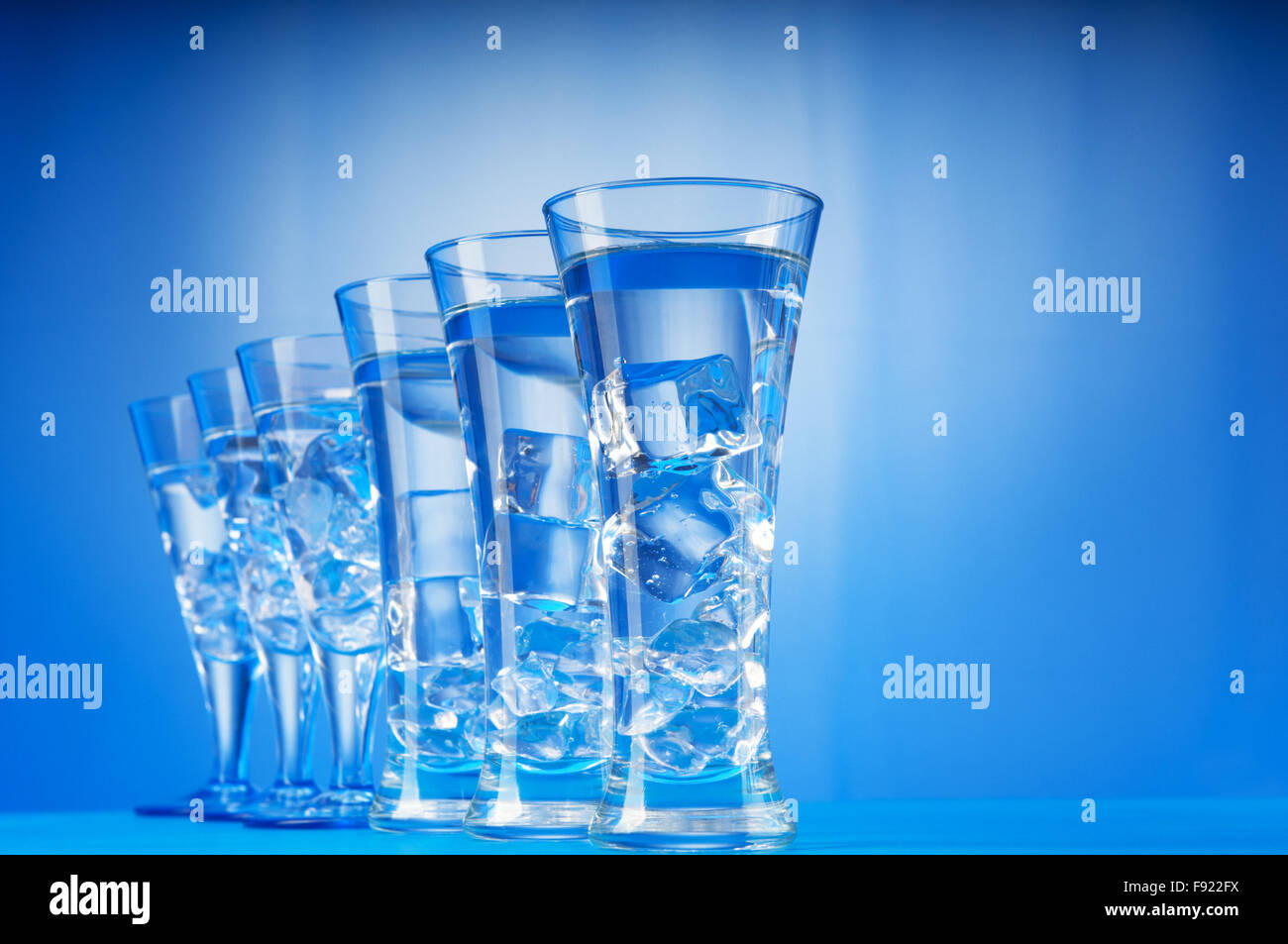 Water in the glass against gradient background Stock Photo - Alamy