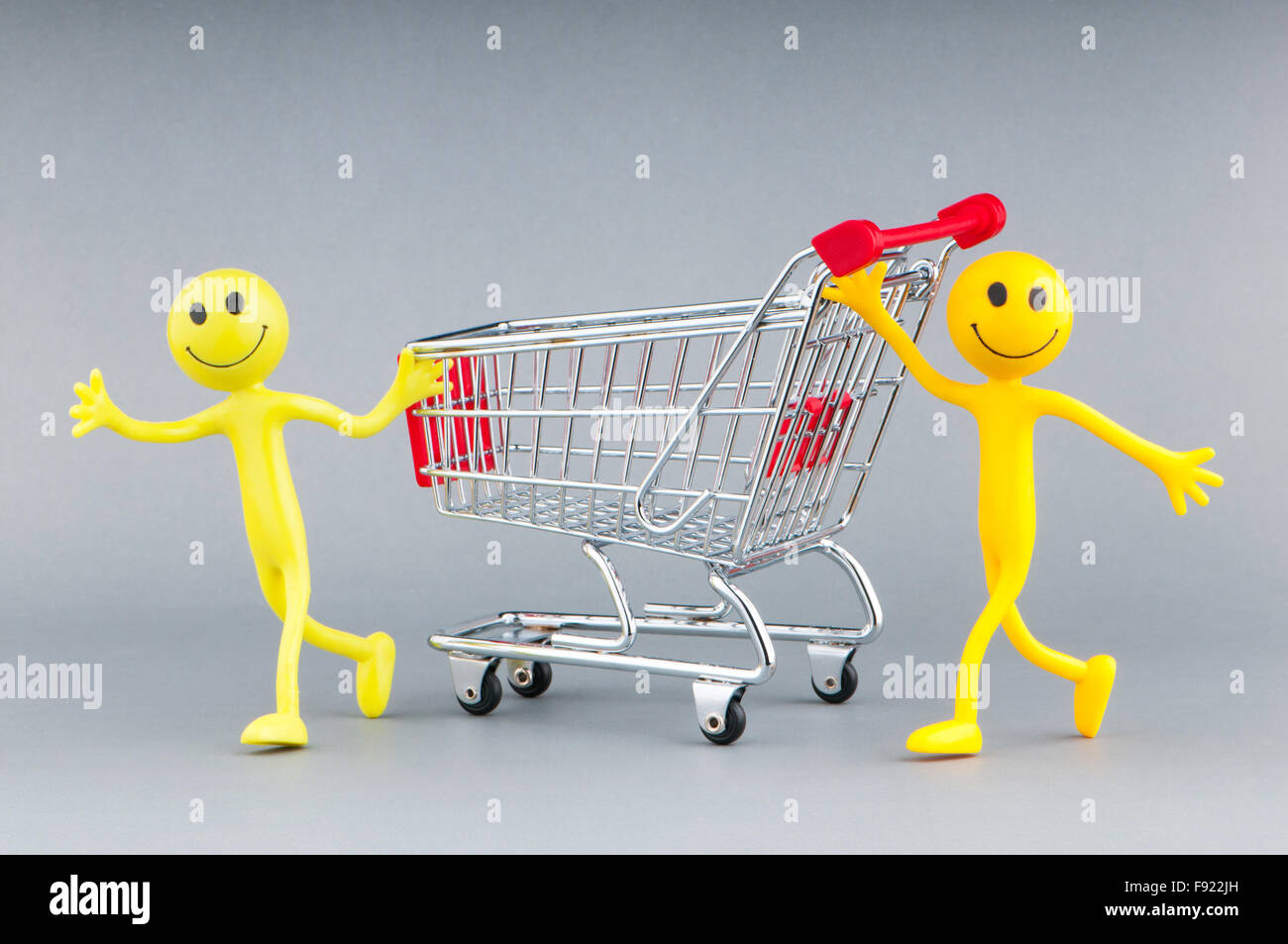 Shopping cart and happy smilies Stock Photo - Alamy